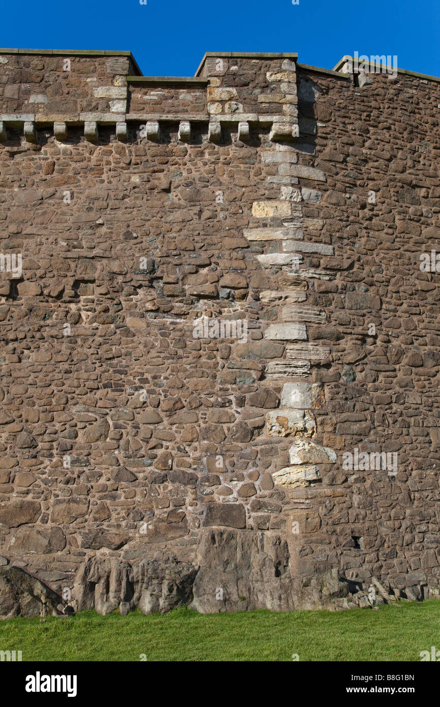 Castle wall with green grass and blue sky Stock Photo - Alamy