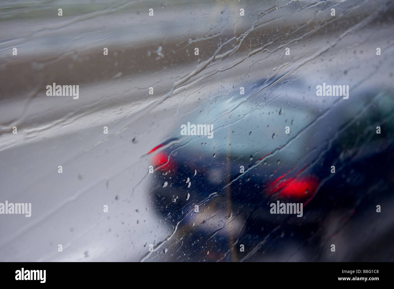 car driving in heavy rain on a freeway or motorway Stock Photo - Alamy