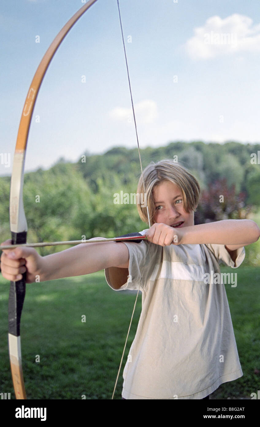 Blonde Boy targeting at something with his Bow - Archery - Weapon ...