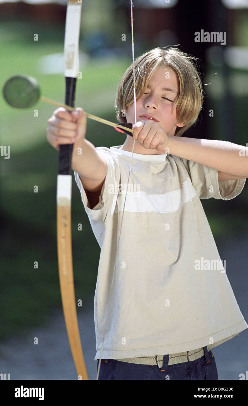 Blonde Boy targeting at something with his Bow - Archery - Weapon ...