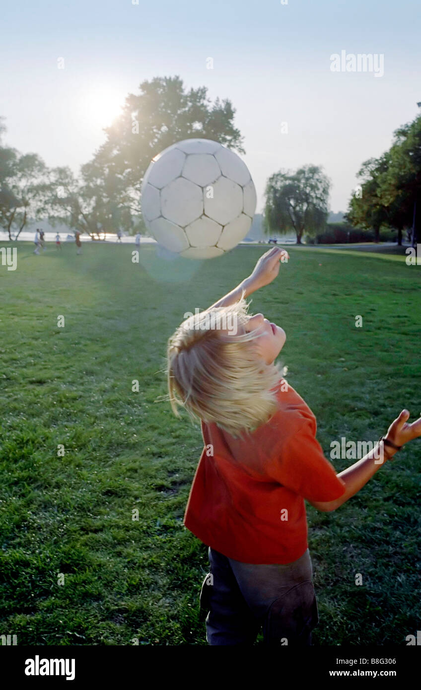 Blonde Boy doing a Header - Soccer - Leisure Time - Youth - Meadow ...