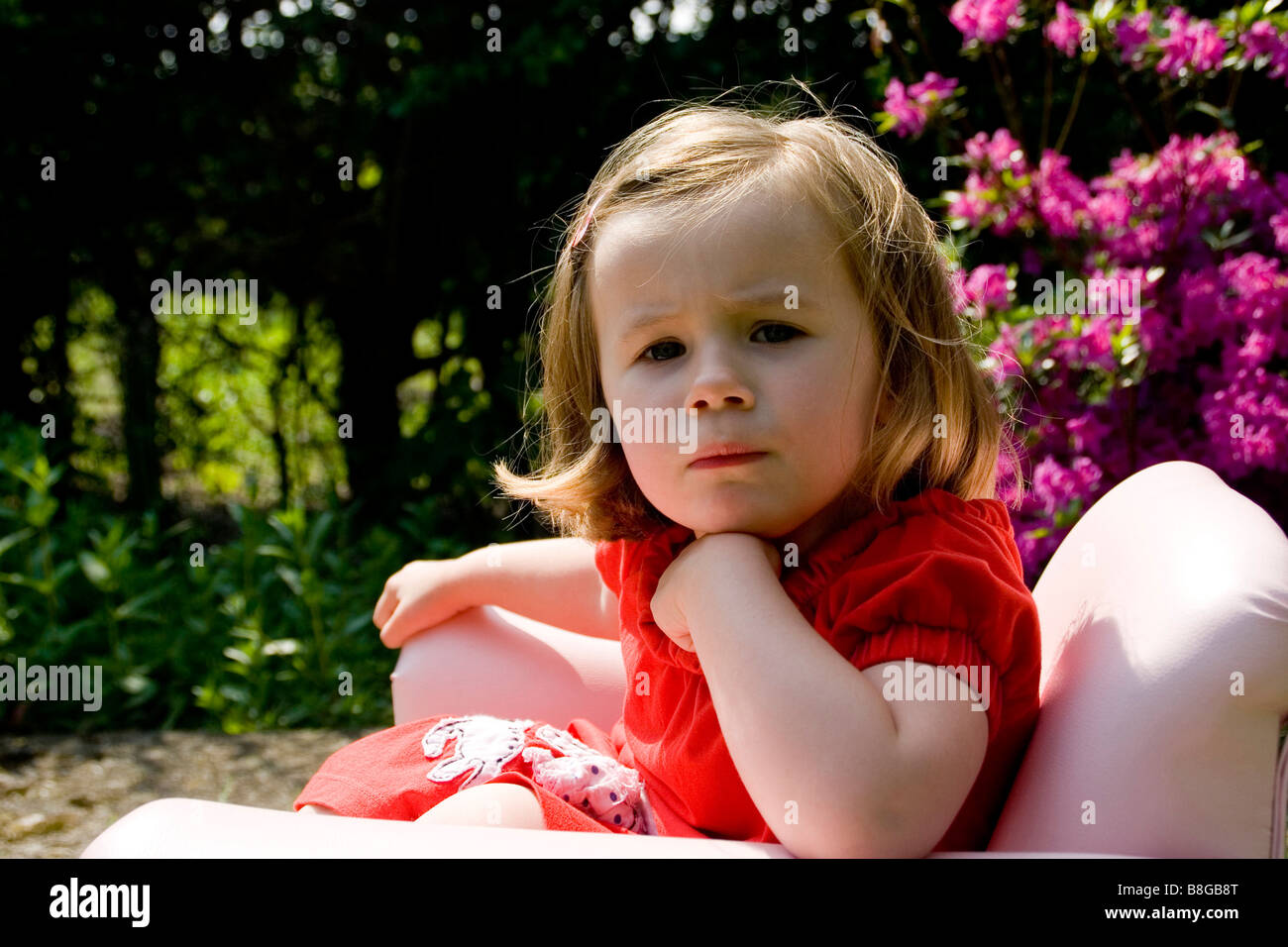 Young child frowning Stock Photo - Alamy