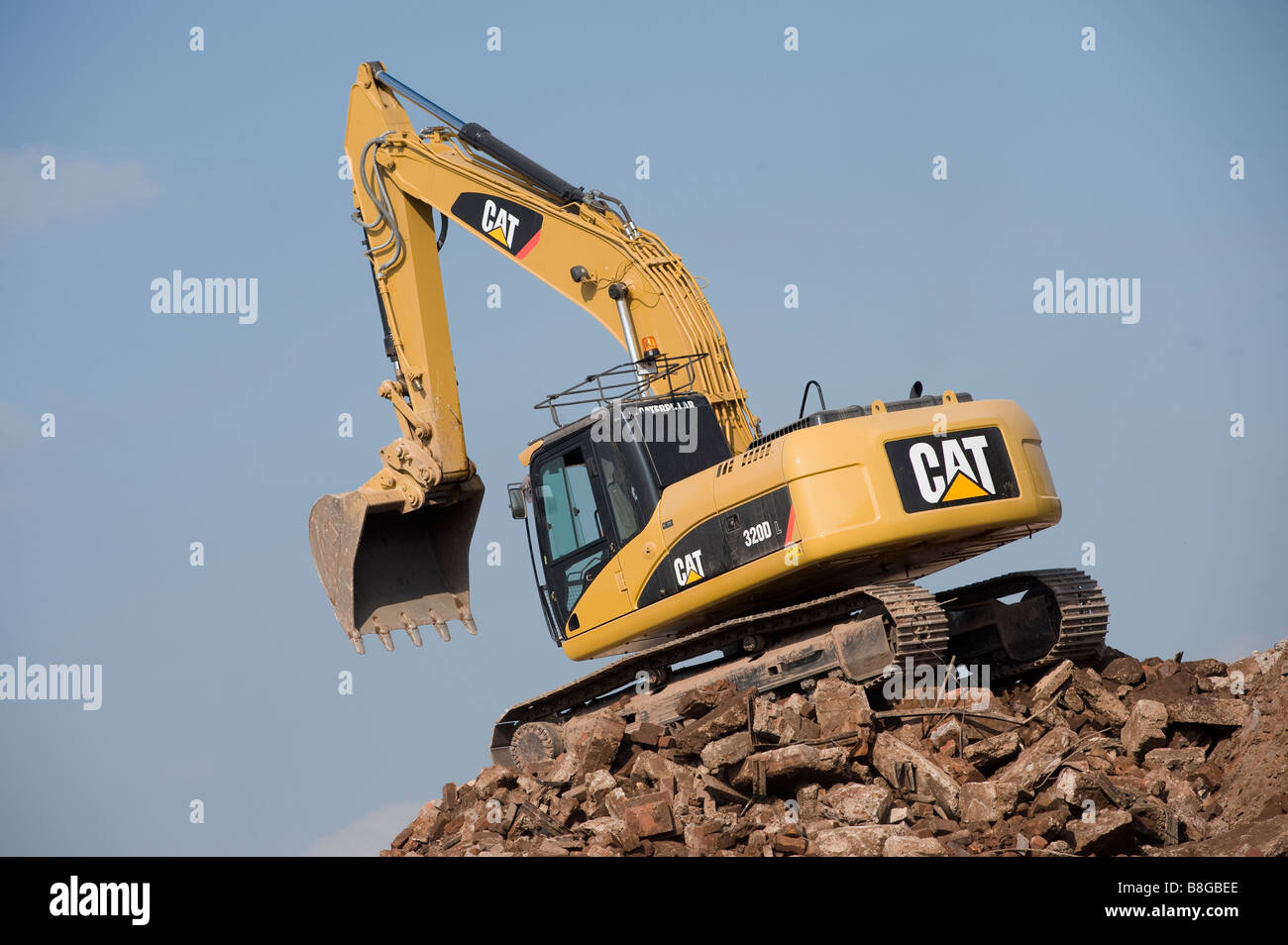 Yellow Caterpillar 320D tracked hydraulic excavator working on a ...