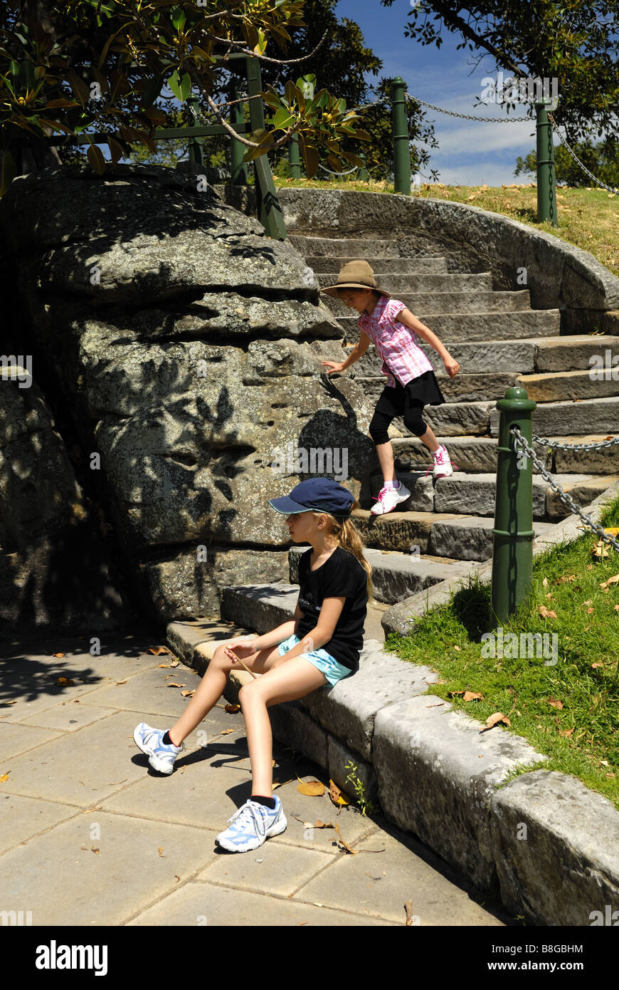 Two children (10 years old, 6 years old) on carved steps near Mrs ...