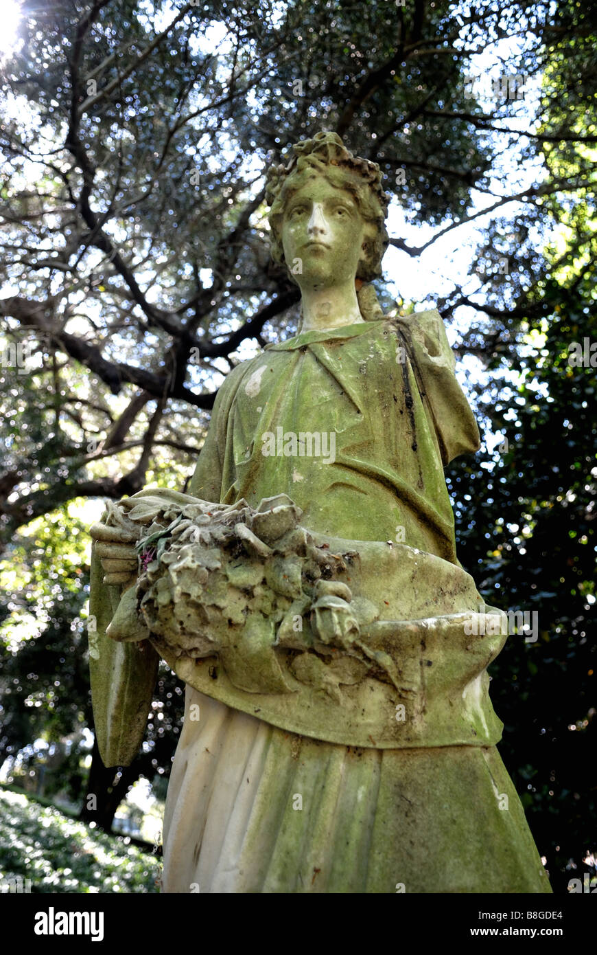Vandalised marble statue, missing an arm, representing Spring in the ...
