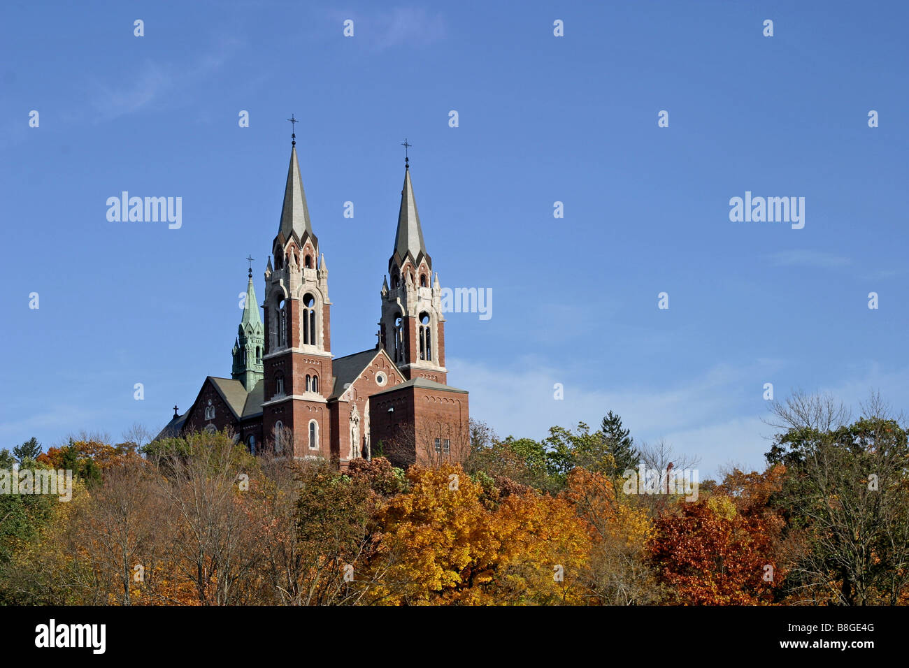 Church on Hill Autumn and Fall colors tall steeples into a clear blue ...