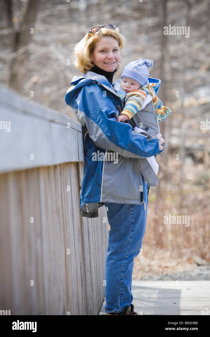 Woman mature mother walk carrying hi-res stock photography and images ...