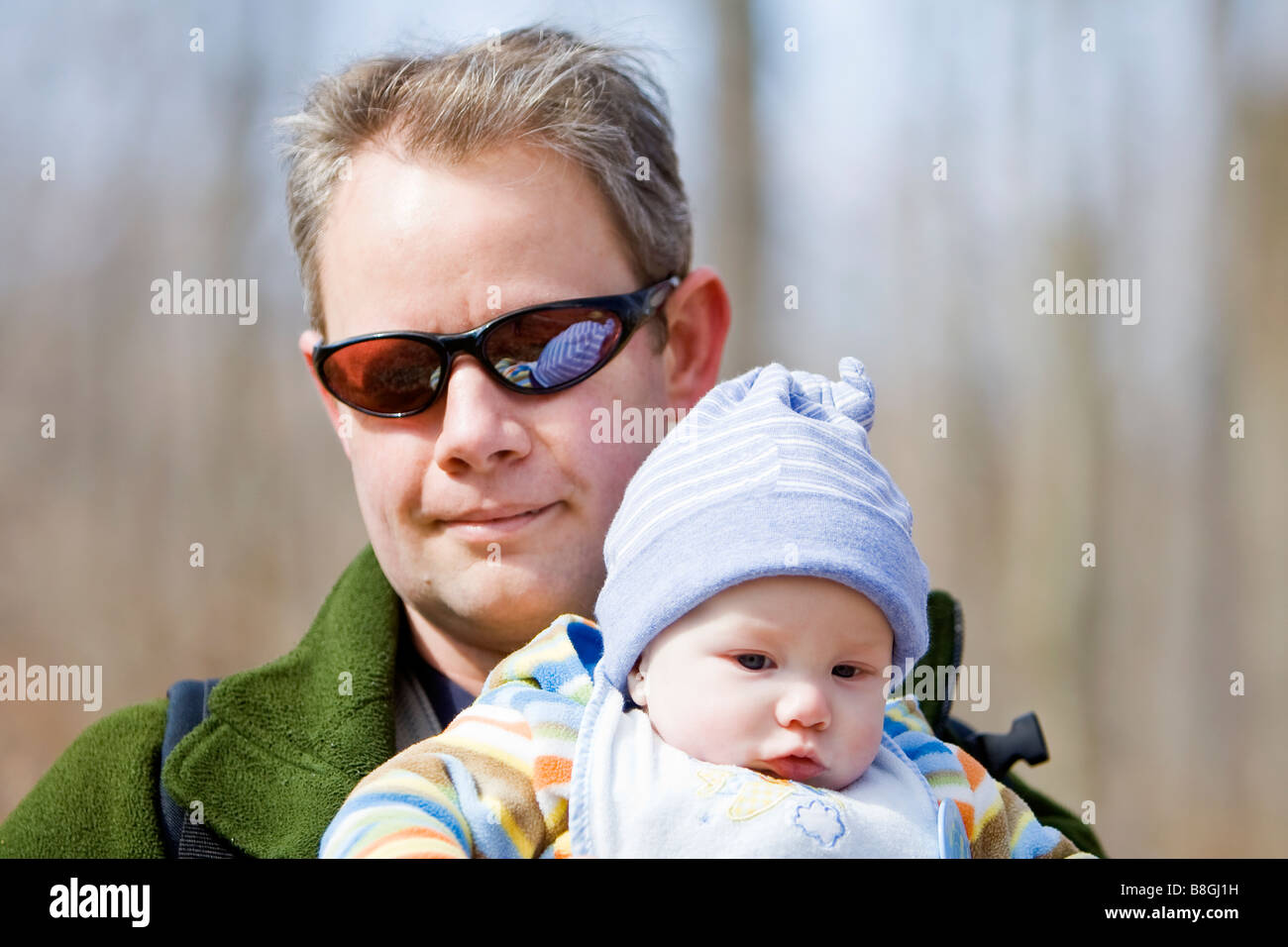 Proud father carrying baby boy Stock Photo - Alamy