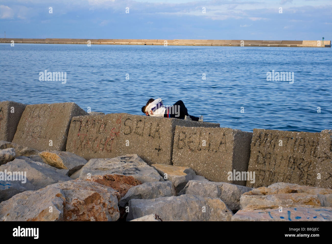 A passionate couple at the Foro Italico seafront, Palermo, Sicily ...