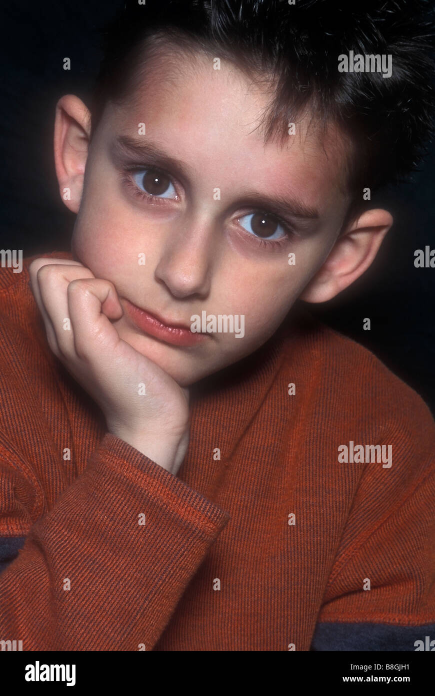 Boy resting chin hand hi-res stock photography and images - Alamy