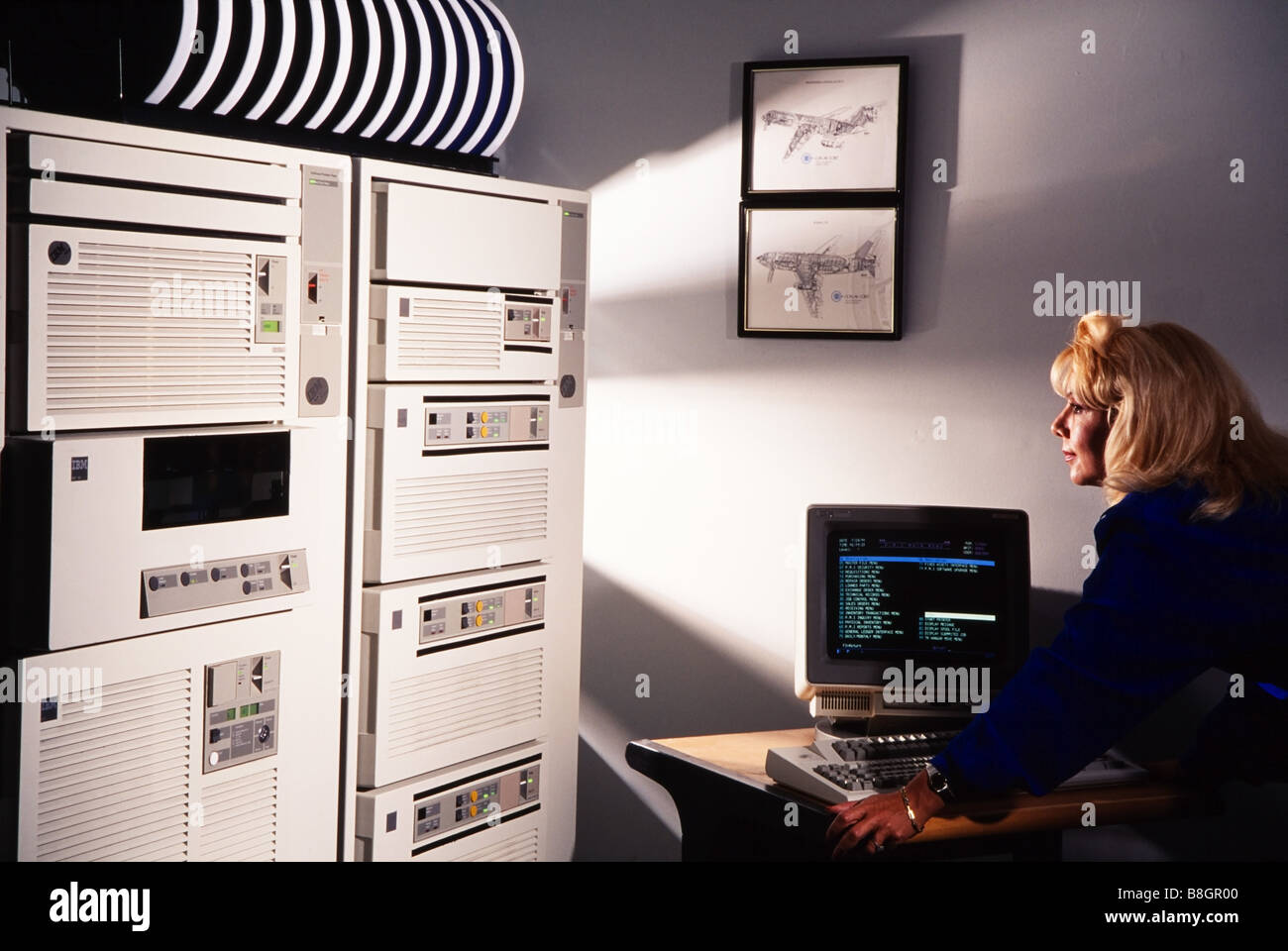 Executives at work in office setting with computer Stock Photo - Alamy