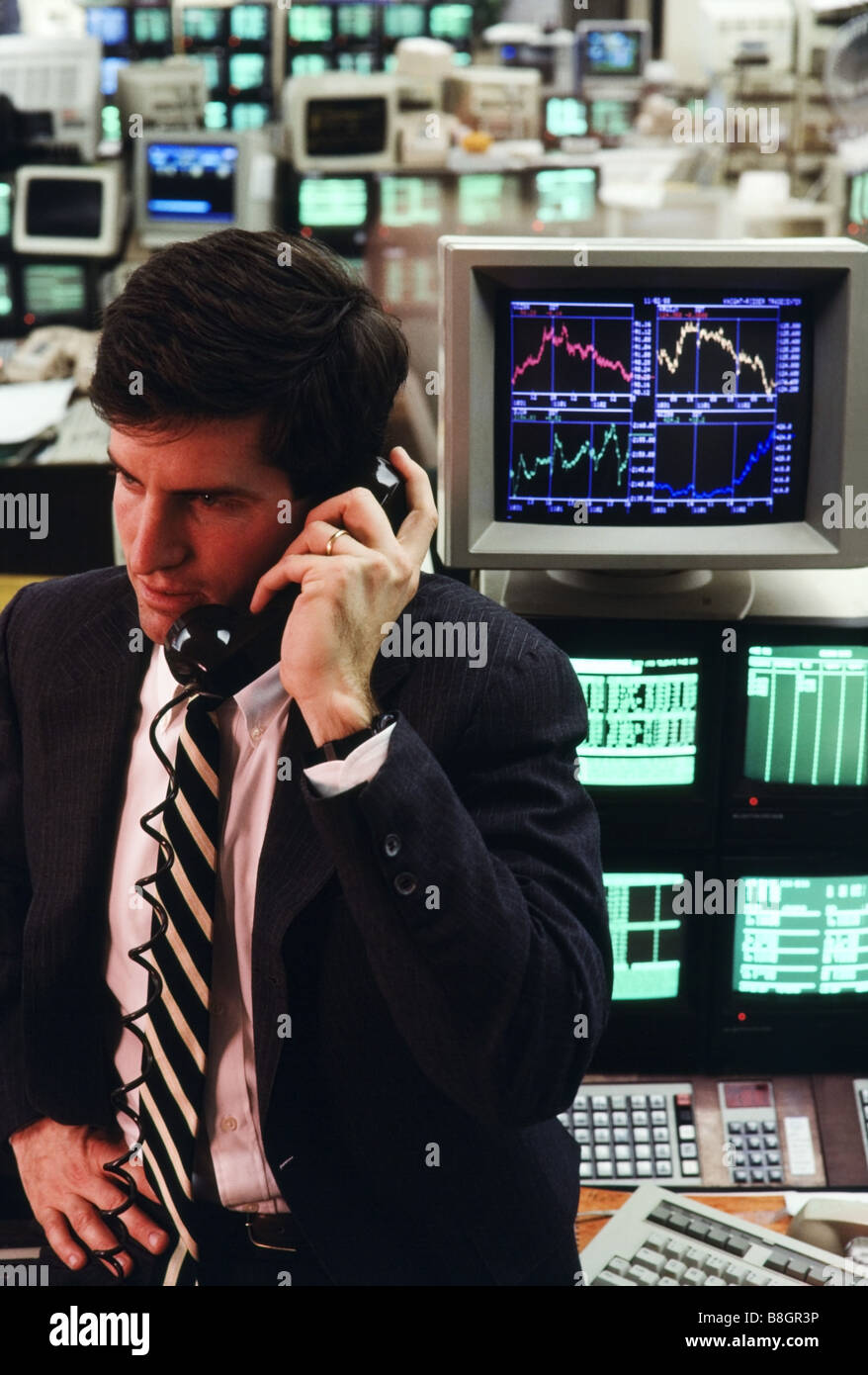 Executives at work in office setting with computer. Goldman Sacks Stock ...