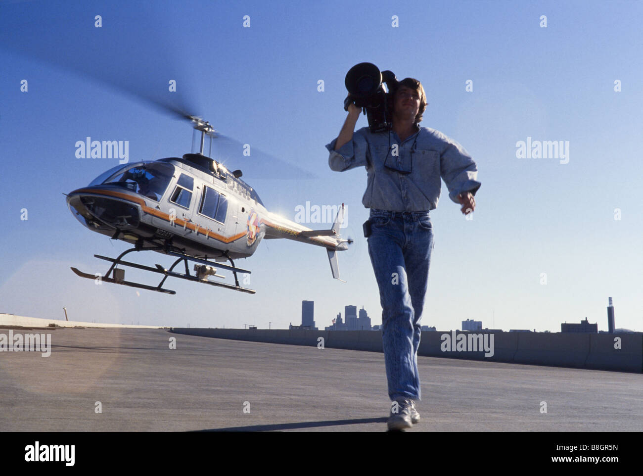 People working,TV cameraman with traffic helicopter Stock Photo - Alamy