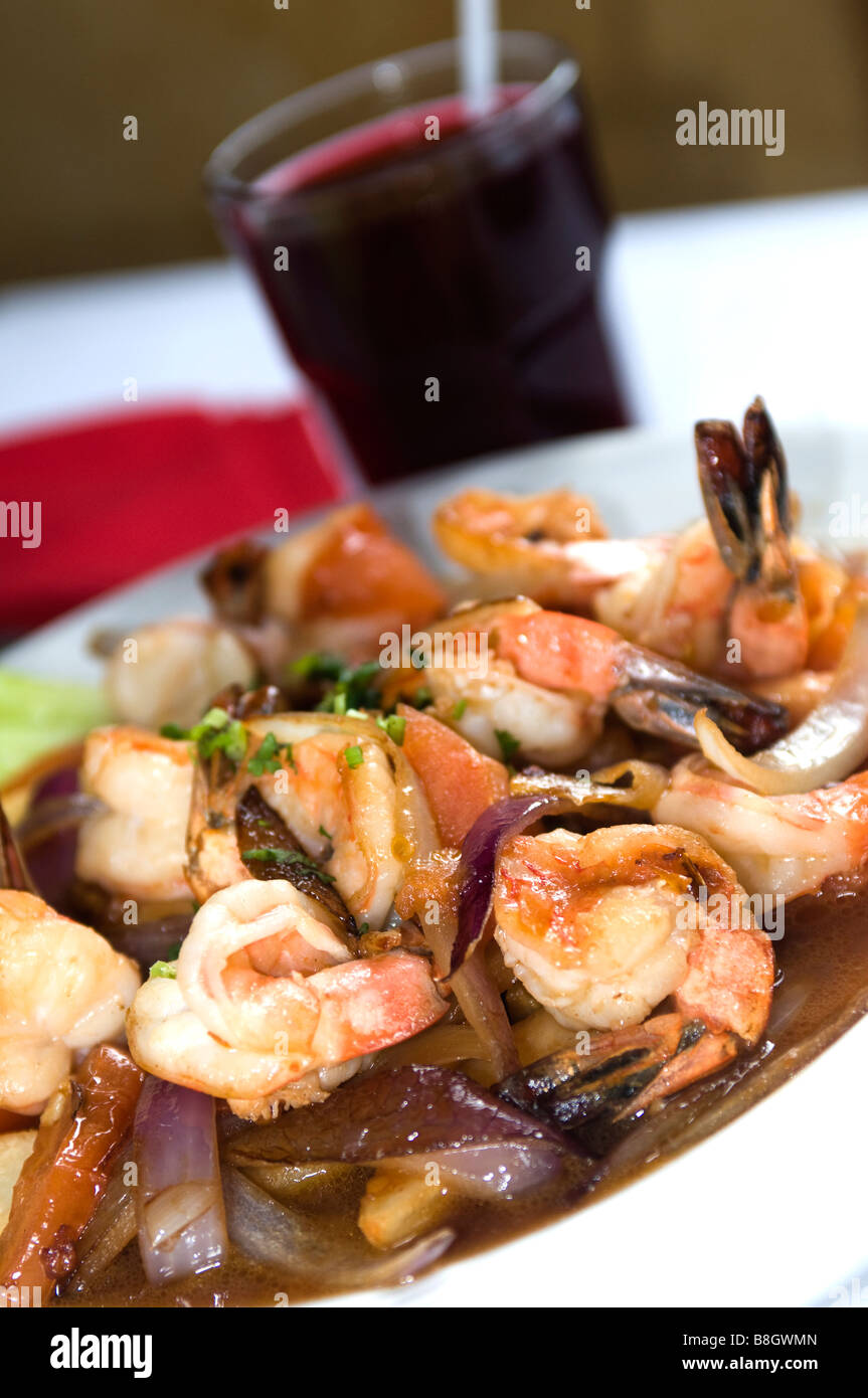 camaron shrimp saltado Peruvian food with national Peru drink chicha ...