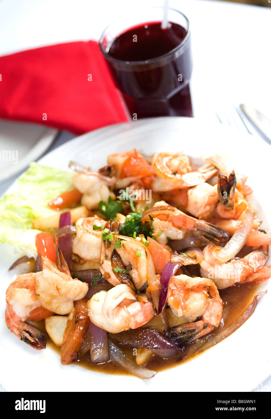 camaron shrimp saltado Peruvian food with national drink chicha morada ...