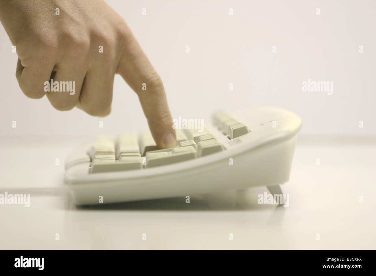 Male indexfinger pointing at keyboard Stock Photo - Alamy