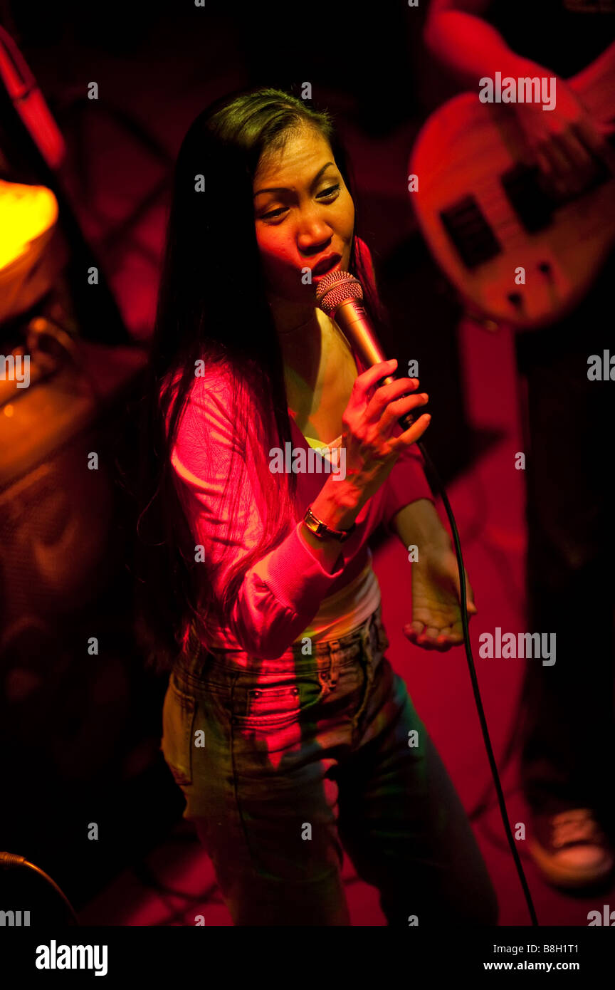 Thai singer in a jazz bar 4 Stock Photo - Alamy