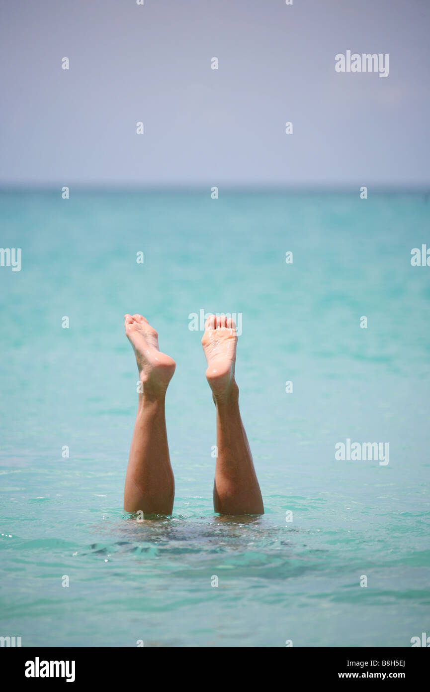 Woman legs dive in water hi-res stock photography and images - Alamy