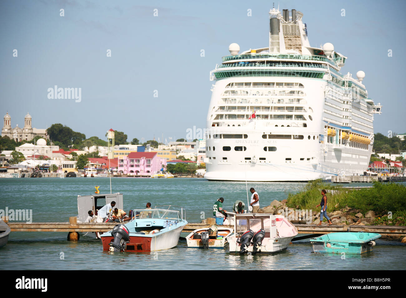 A cruise ship docked in the harbour of St. John’s on the Caribbean isle ...