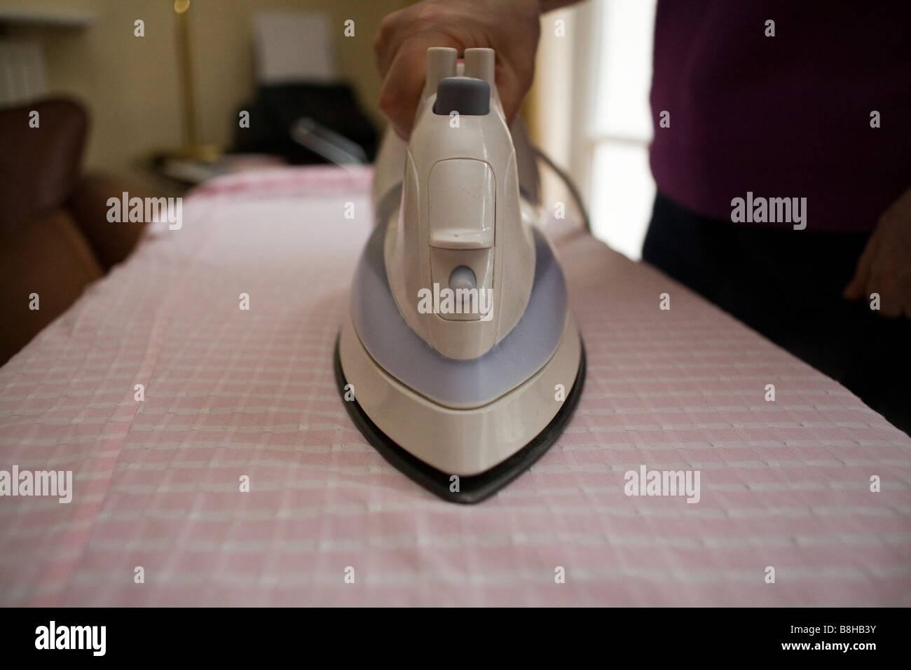 domestic ironing in the home Stock Photo - Alamy