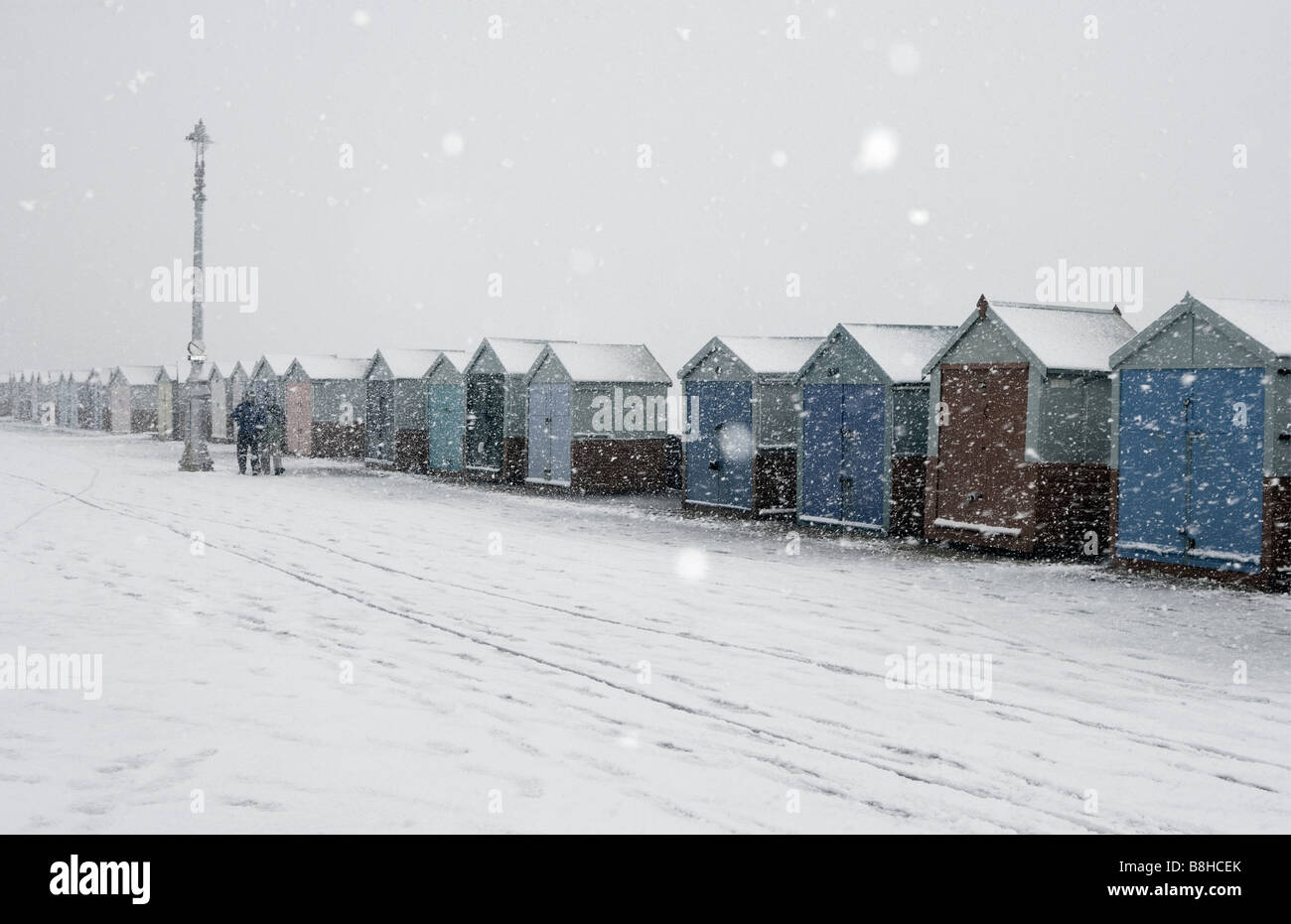 Snow falling on beach huts in Hove, England Stock Photo - Alamy