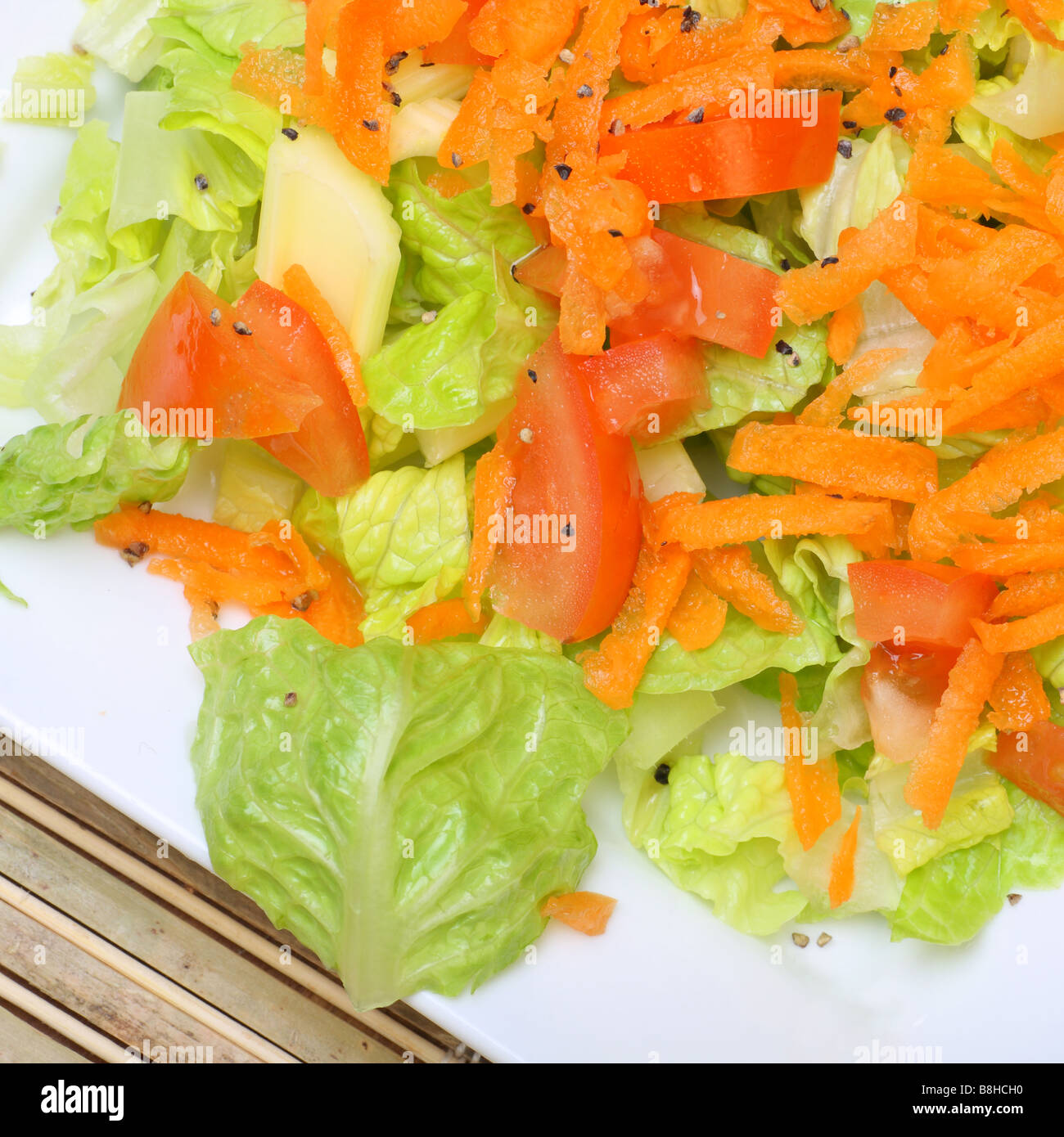 freshly prepared salad with black pepper dressing Stock Photo - Alamy