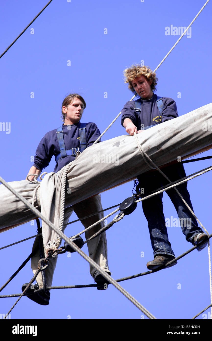 Two Sailors Working on Rigging of Tall Ship, Earl of Pembroke Stock ...