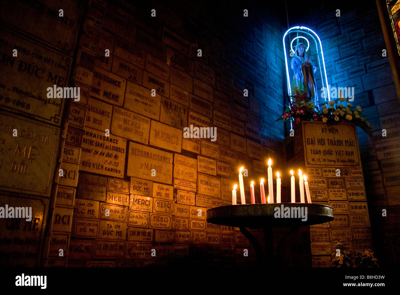 A Neon surrounded Virgin Mary statue in the Notre Dame Cathedral ...