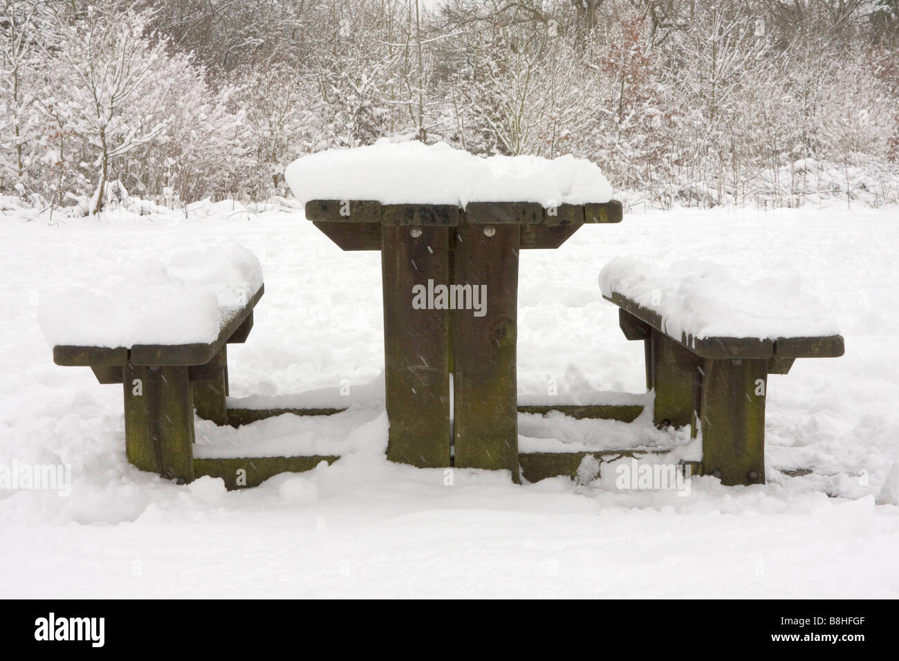 Picnic bench covered in snow Stock Photo - Alamy