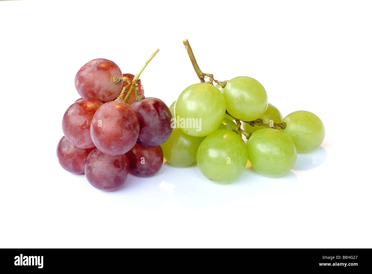 Red and white grapes on white background Stock Photo - Alamy