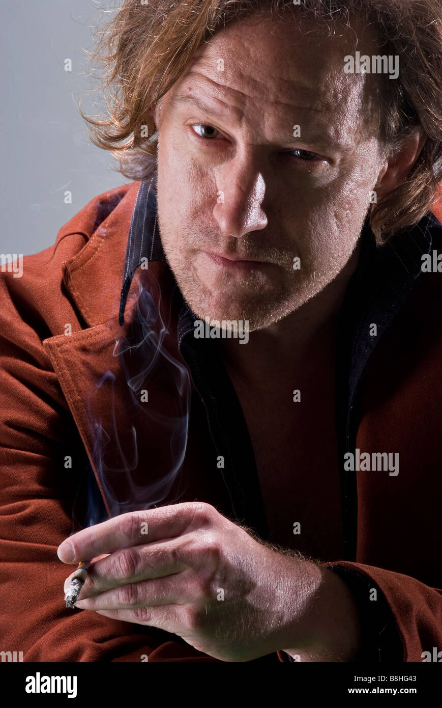Man smoking cigarette Stock Photo - Alamy