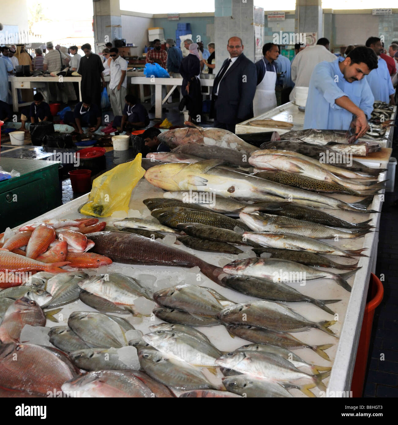 Fish displays and fishmonger vendors at work in Fujairah fish market ...