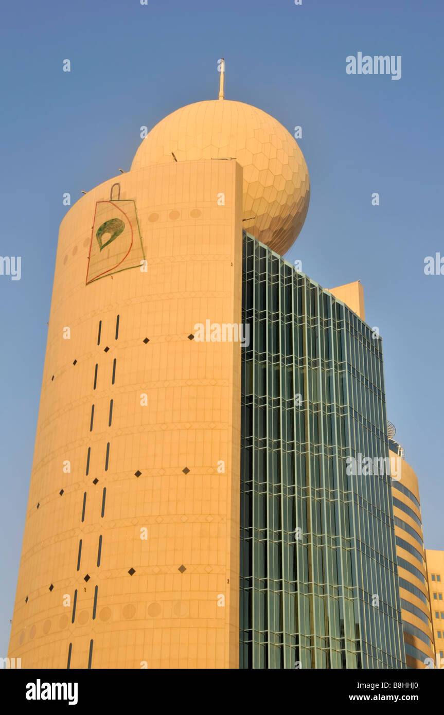 Warm late sunshine casts warm colors on the white Dubai Etisalat Tower ...