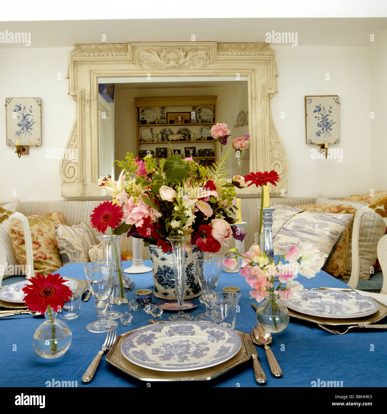 Close up of set table with blue linen tablecloth, blue and white china ...