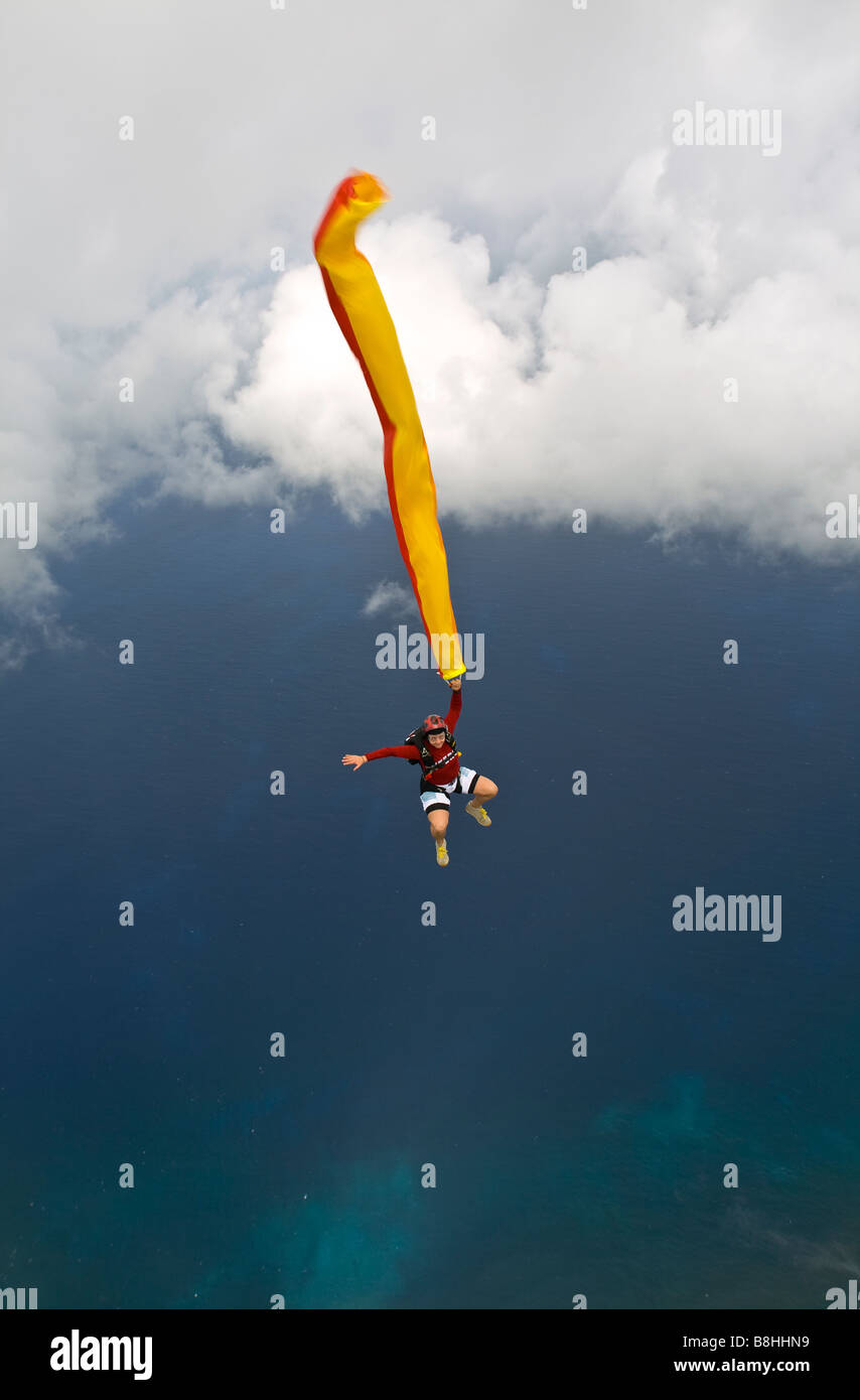 Skydive tube jump over Oahu, Hawaii, USA. Diver is flying in sit ...