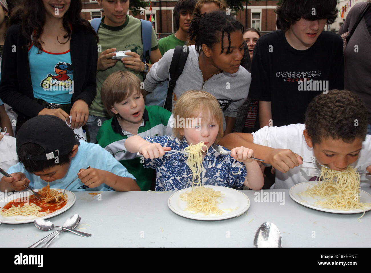 Children take part in a spaghetti eating contest Stock Photo - Alamy