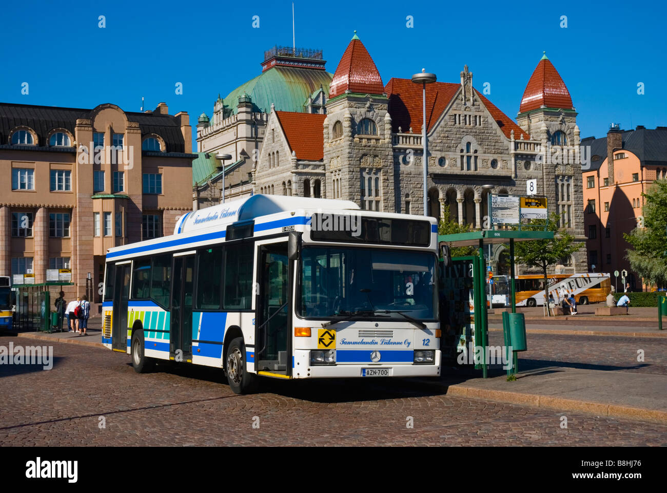 Rautatientori bus station with the national theatre building in ...
