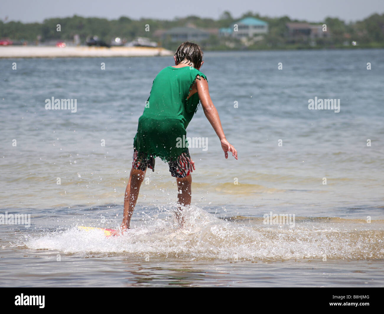 boy skim boarding at the beach Stock Photo - Alamy