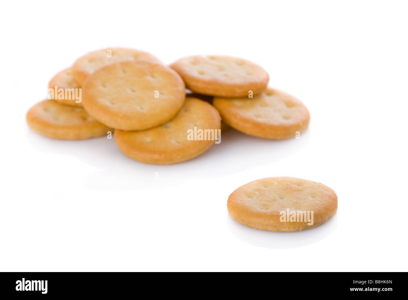 Small appetizer crackers isolated on white background Stock Photo - Alamy