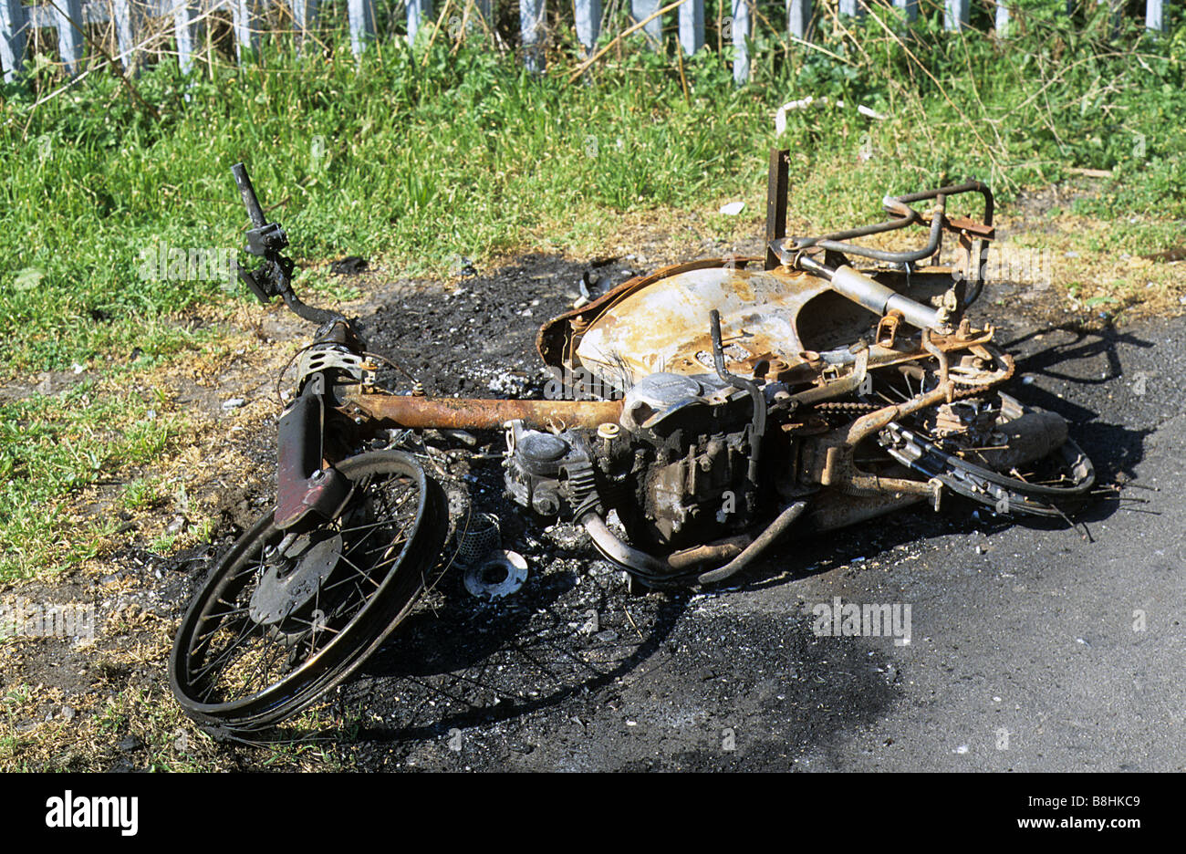 Burned out moped on waste land, London SE14 Stock Photo - Alamy
