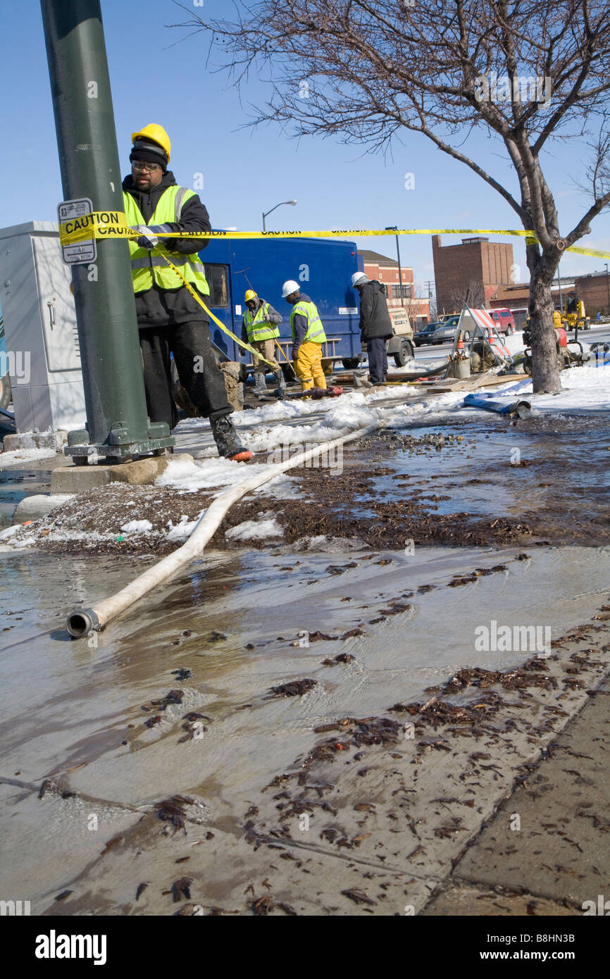 Detroit Michigan City workers repair a break in a water main Stock ...