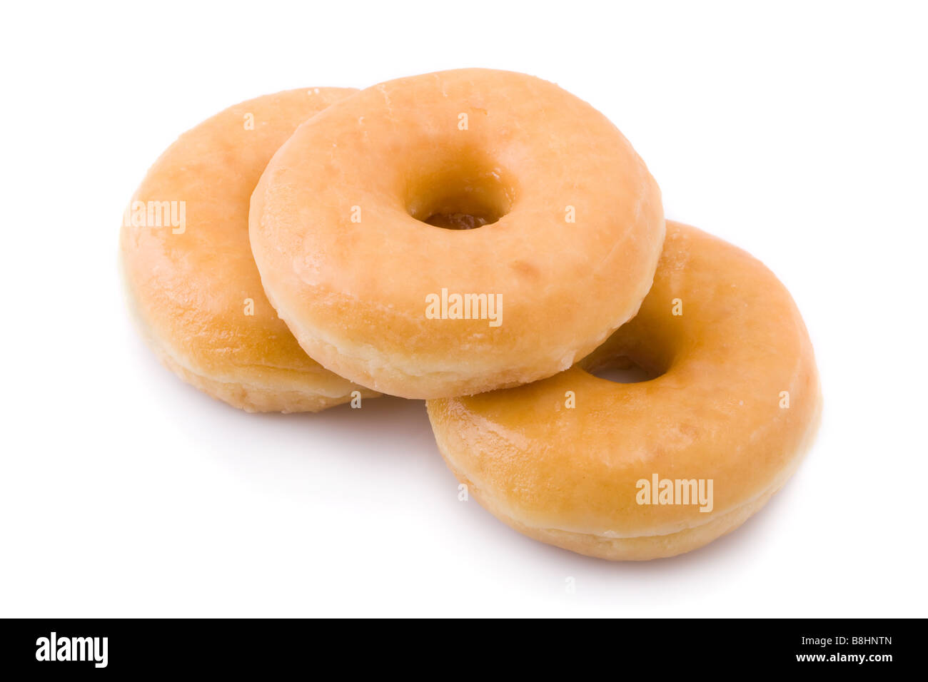 Three doughnuts or donuts piled isolated on white Stock Photo - Alamy