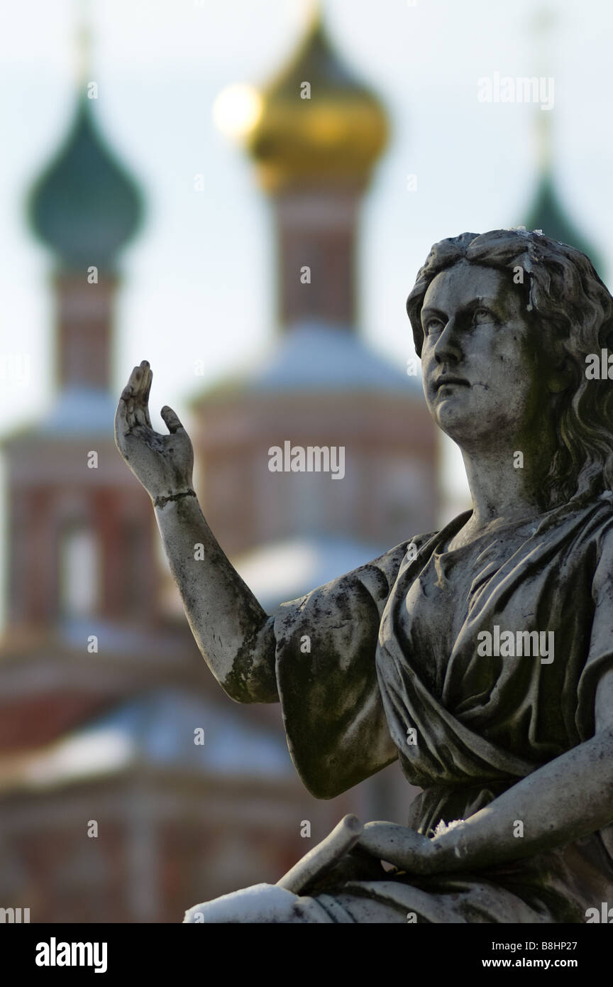 Statue of angel with domes of Russian orthodox church in background ...