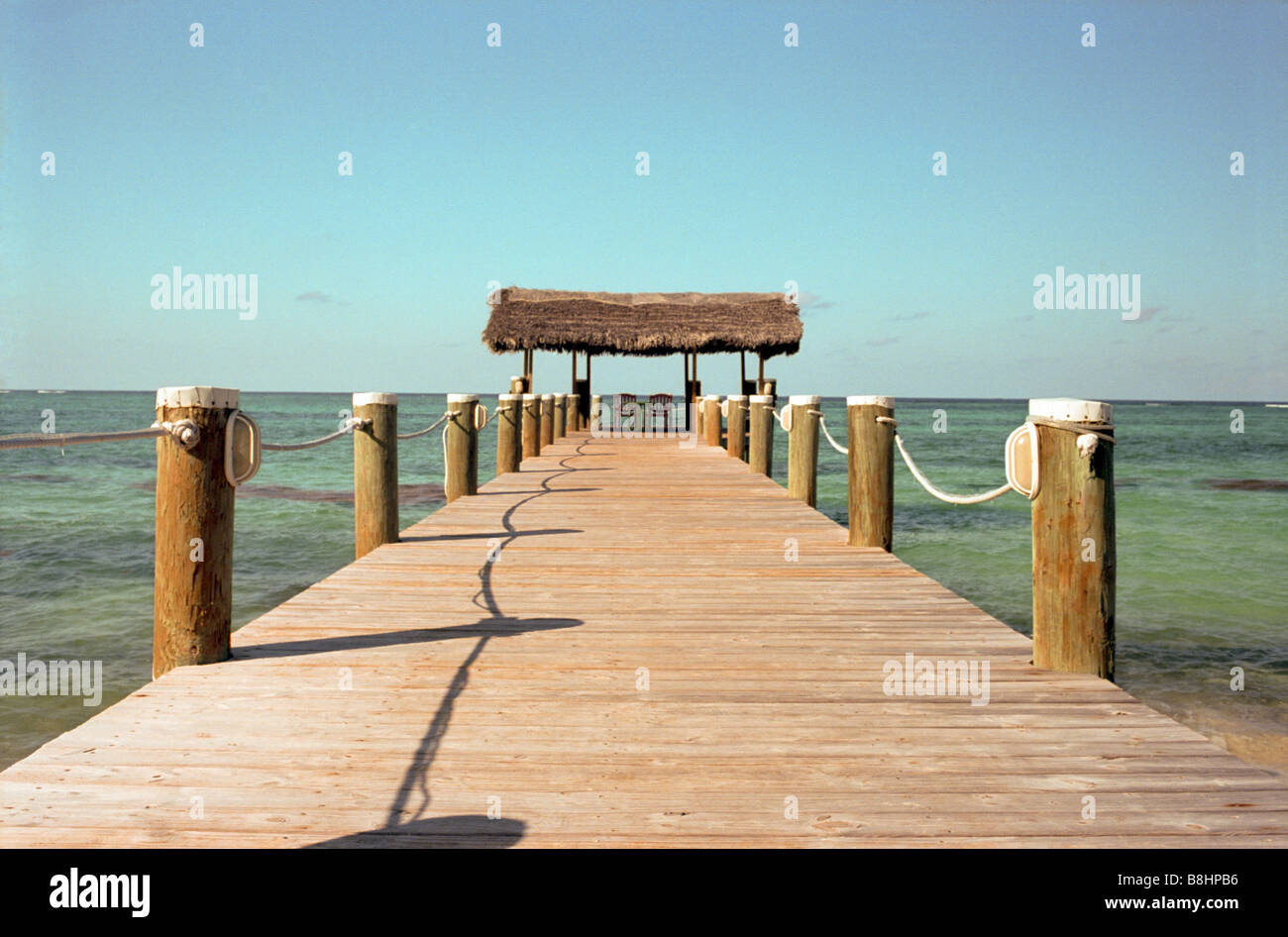 Caribbean pier and beach hut Stock Photo - Alamy