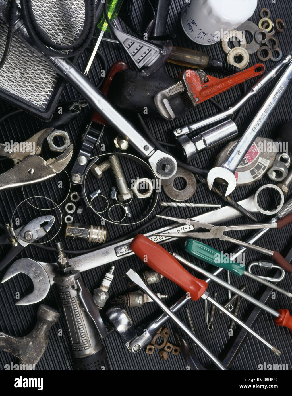 Mess of tools on the workbench Stock Photo - Alamy
