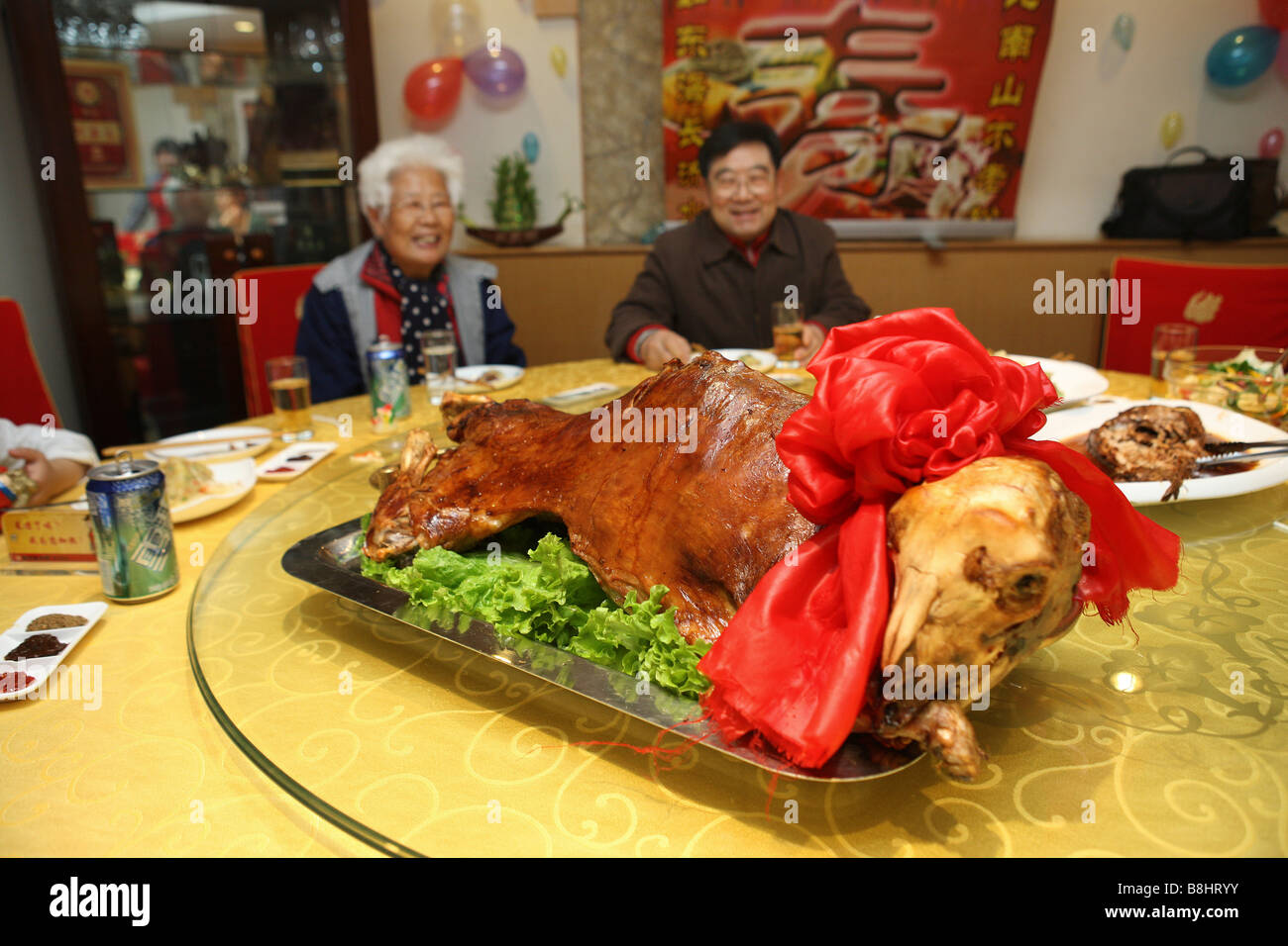 Chinese Family Having Dinner Together In The Restaurant Stock Photo - Alamy