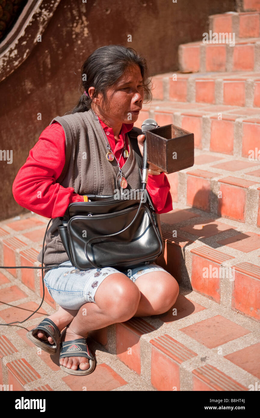 Poor street singer in Thailand Stock Photo - Alamy