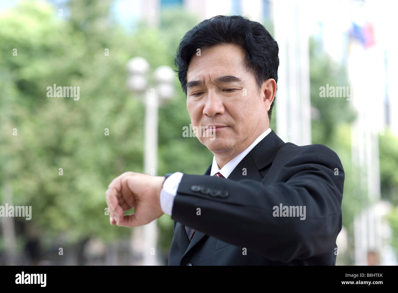 Selective focus man looking clock hi-res stock photography and images ...