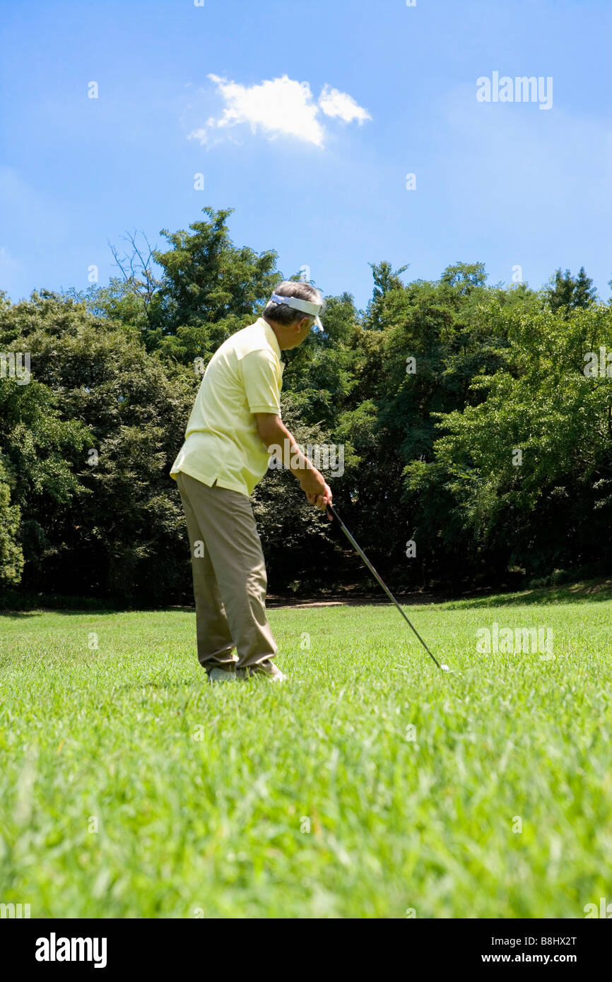 Senior man playing golf Stock Photo - Alamy