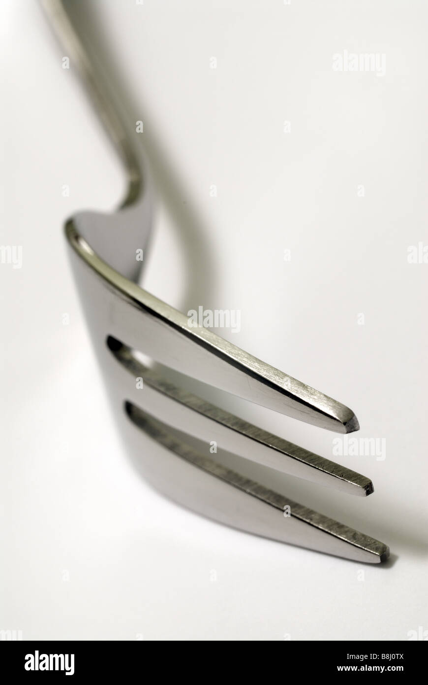 one fork on a white background Stock Photo - Alamy